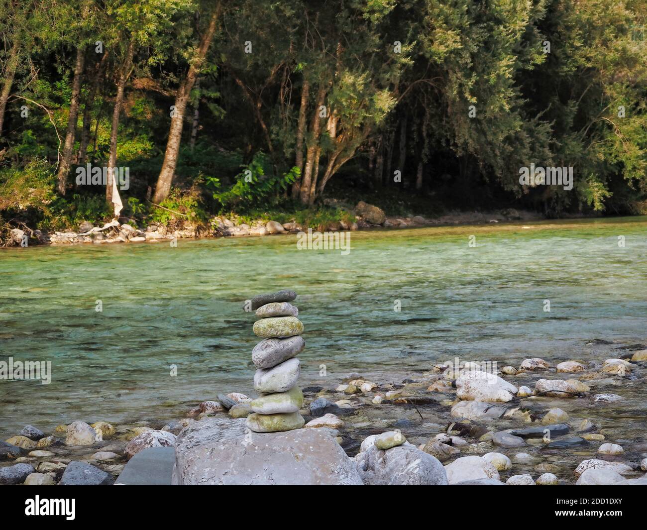 A closeup of various stones stacked up on each other on another huge ...