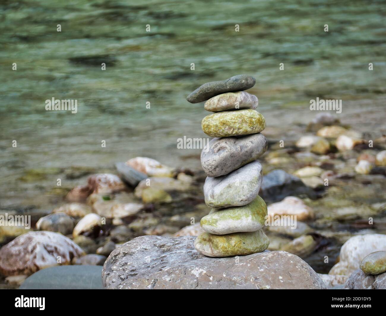 A closeup of various stones stacked up on each other on another huge ...