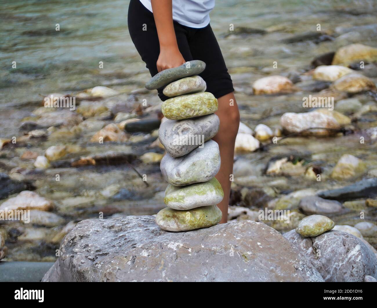 A closeup of various stones stacked up on each other on another huge ...