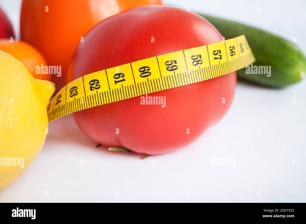 Still life: vegetables and fruits, and a centimeter near them. Healthy ...