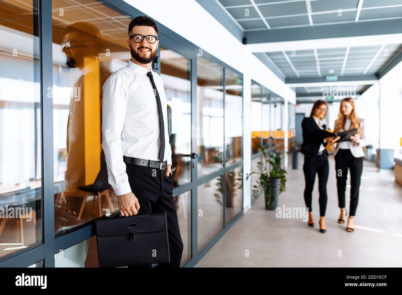 Happy businessman in business clothes in modern office at work Stock ...