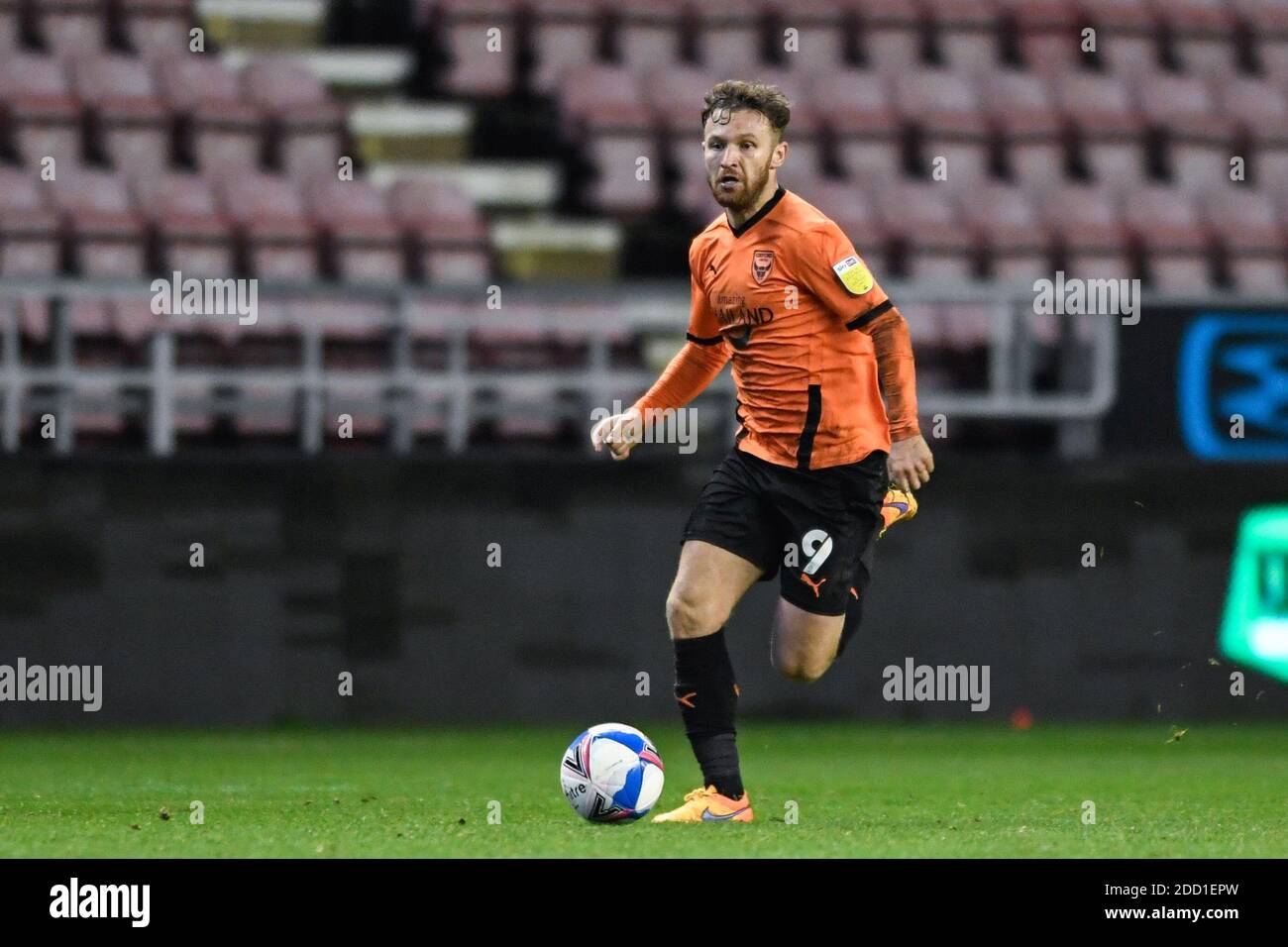Matty Taylor #9 of Oxford United runs forward with the ball Stock Photo ...