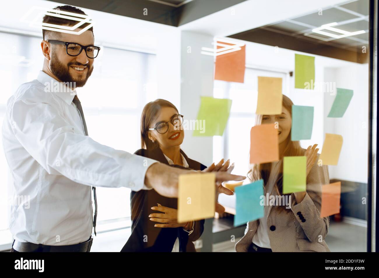 Business start-up partners work together, discussing ideas for a new ...