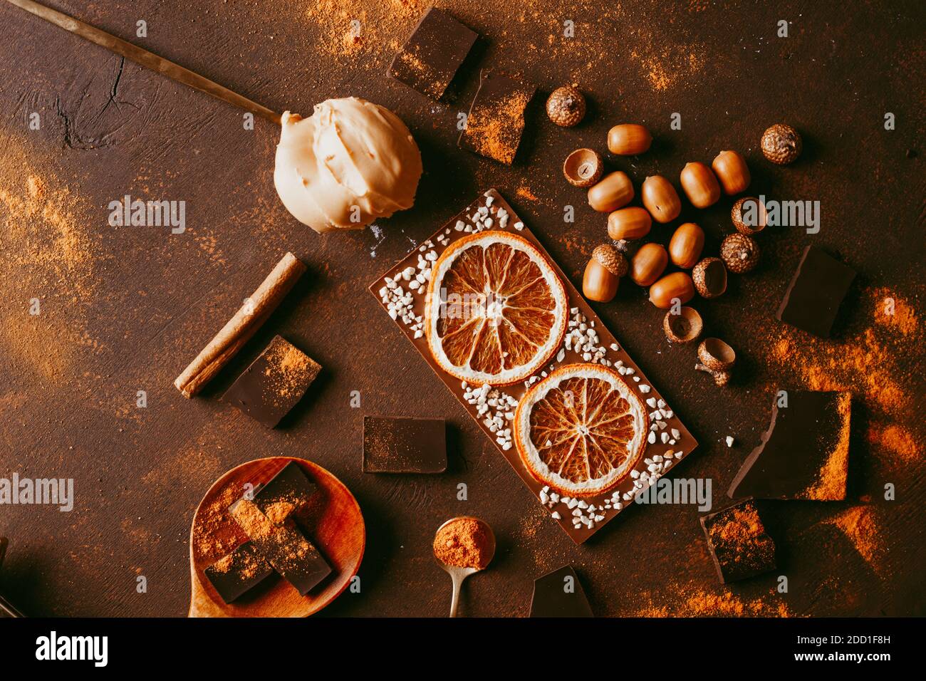 Composition of bars and pieces of different dark chocolate with orange ...