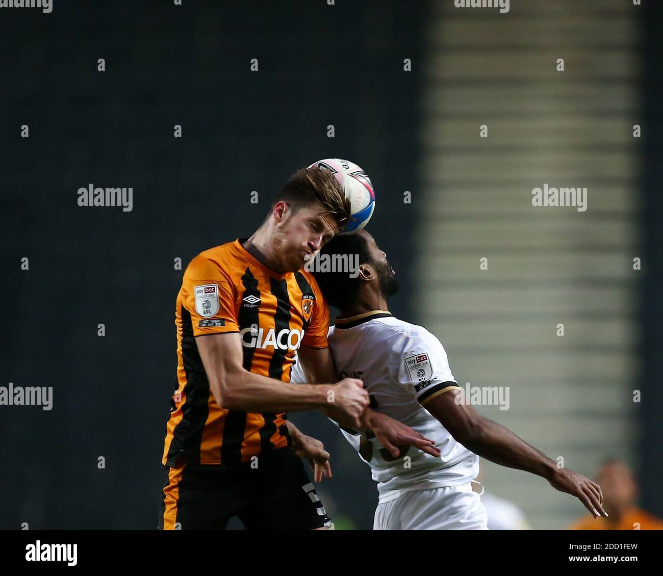 Reece Burke #5 of Hull City and Cameron Jerome #35 of Milton Keynes ...