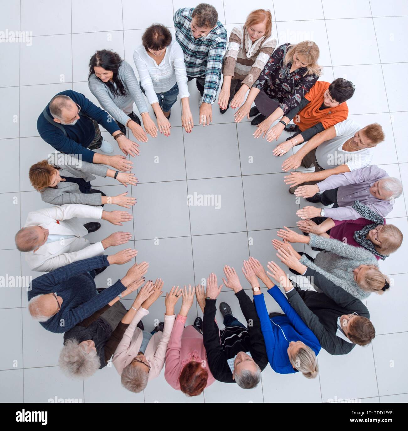 group of mature people showing their unity Stock Photo - Alamy