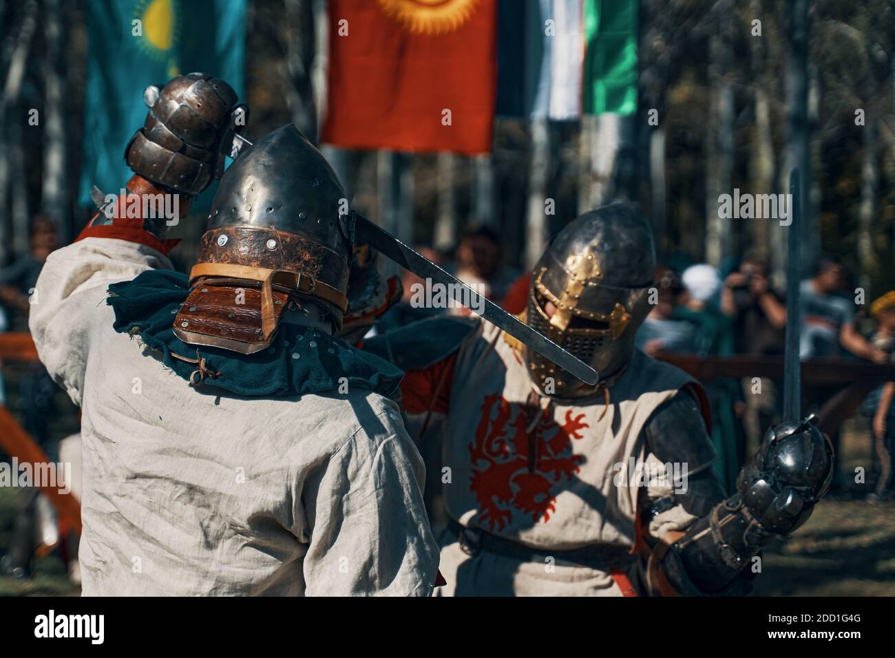 Knights in armor, helmets, with shields and swords. Reconstruction of ...