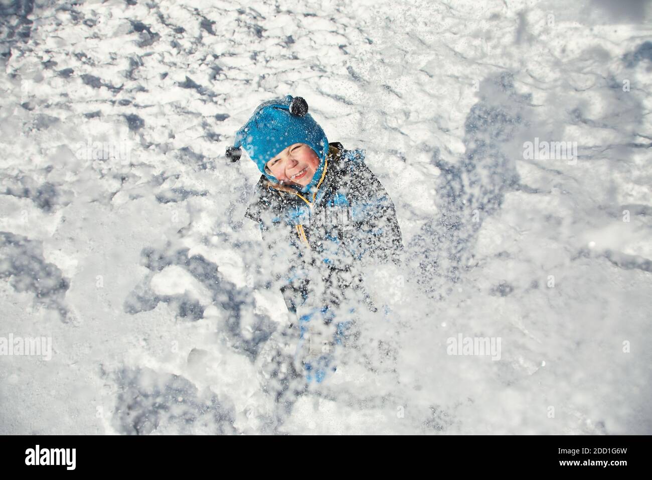 funny little boy playing with snow. child on a walk in the winter Stock ...