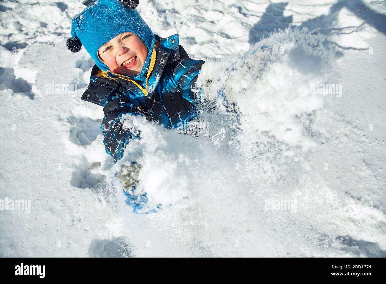 funny little boy playing with snow. child on a walk in the winter Stock ...