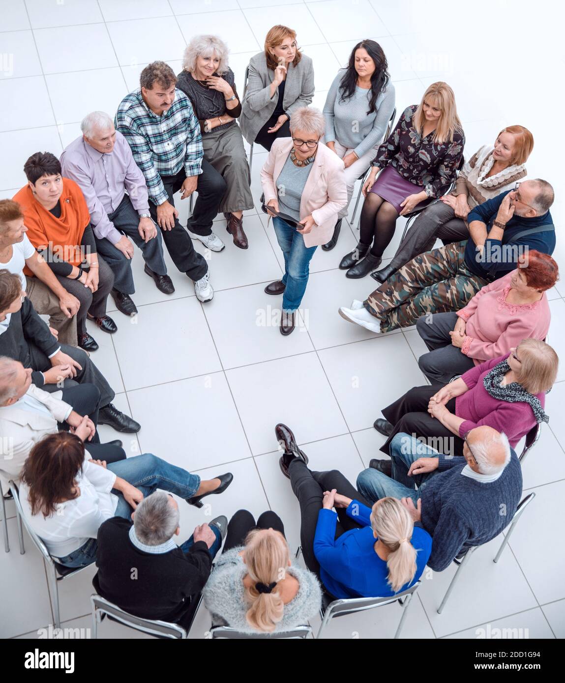 confident older woman standing in a circle of like-minded people Stock ...