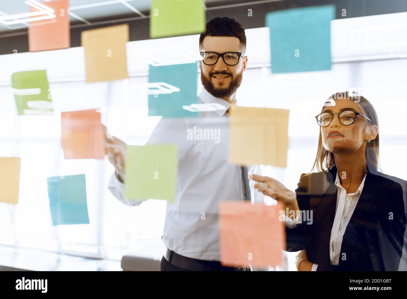 colleagues brainstorm with sticky notes at work in office Stock Photo ...