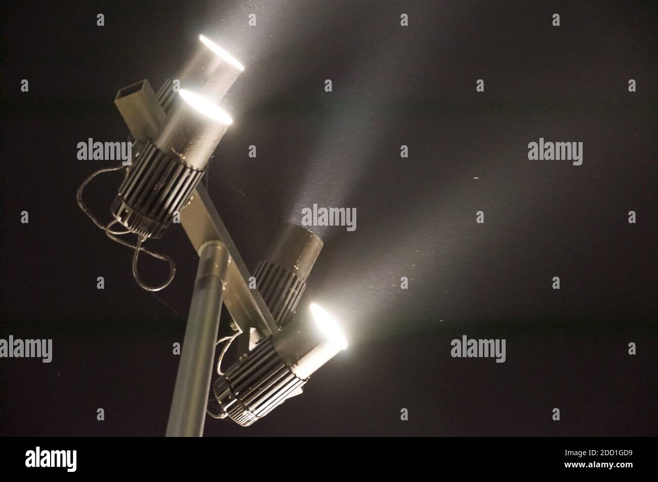 Light beams from spotlights in the fog Stock Photo - Alamy