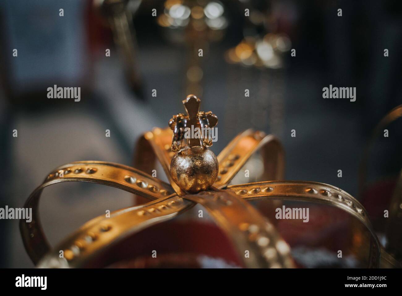 a closeup of a gold crown with a cross Stock Photo - Alamy