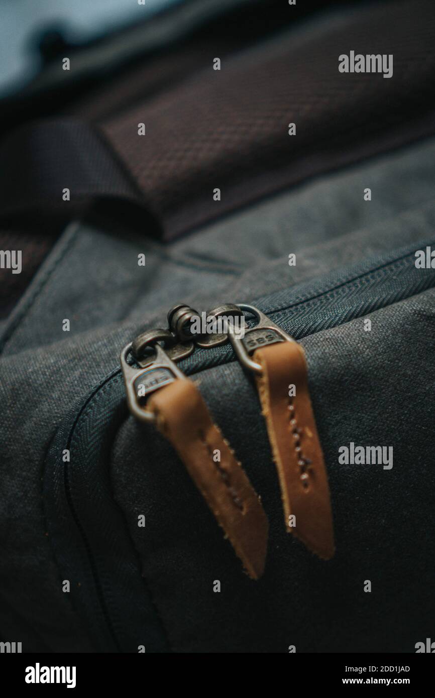 a vertical shot of the suitcase zips with brown leather labels Stock ...