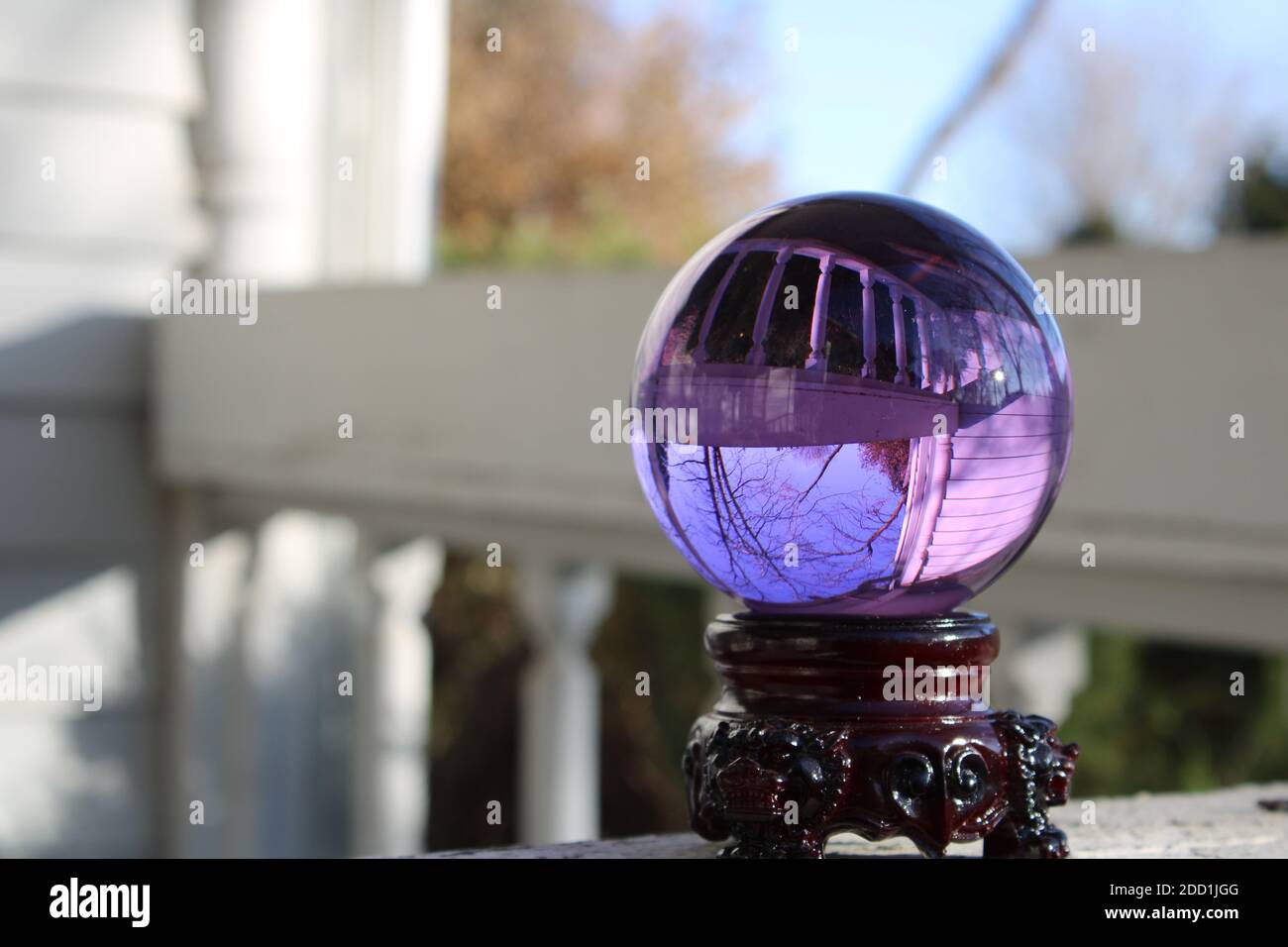 Purple crystal ball on porch Stock Photo - Alamy