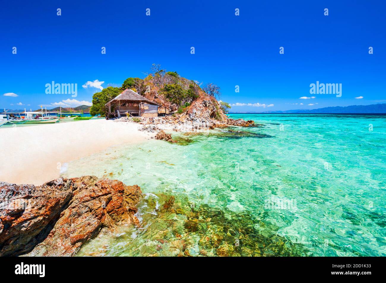 Beauty rocky beach with yellow sand and turquoise water in Busuanga ...