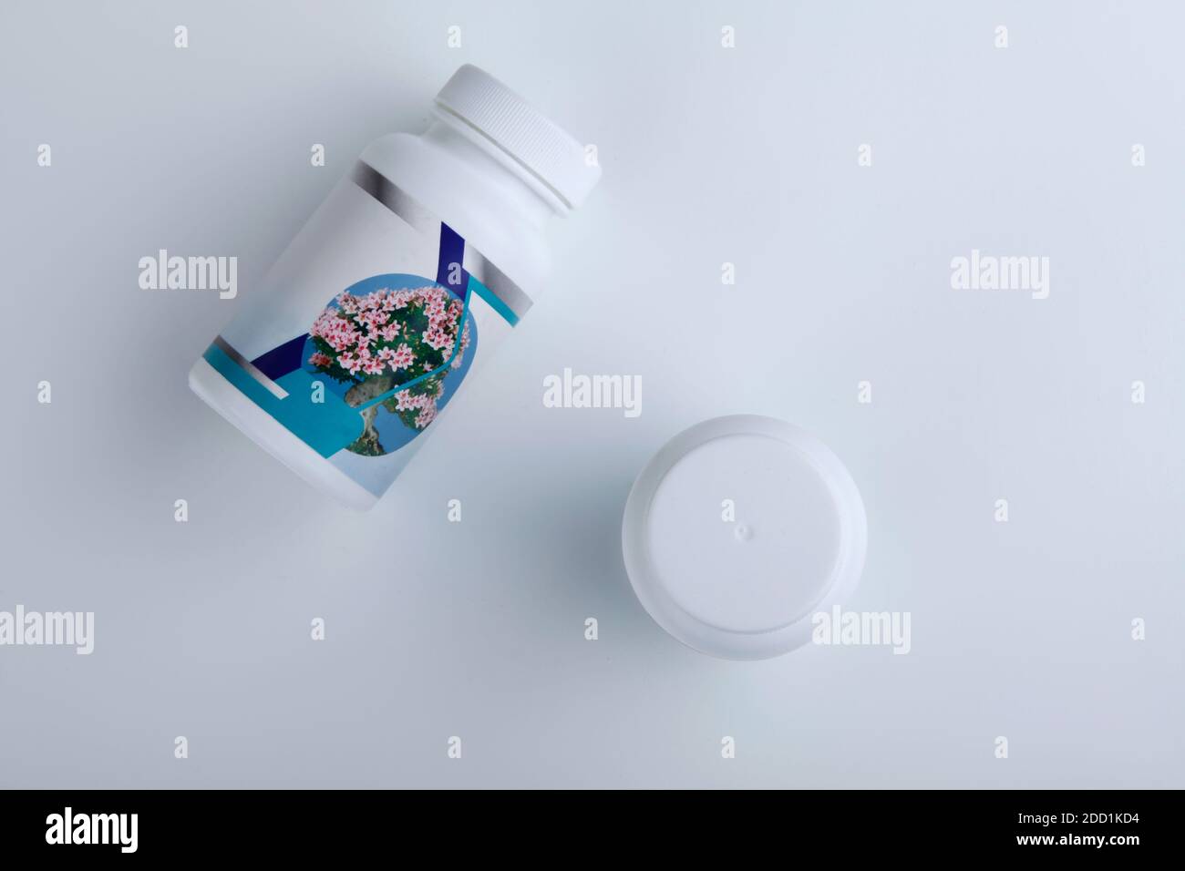 Plant fertilizer bottles isolated on white background Stock Photo - Alamy