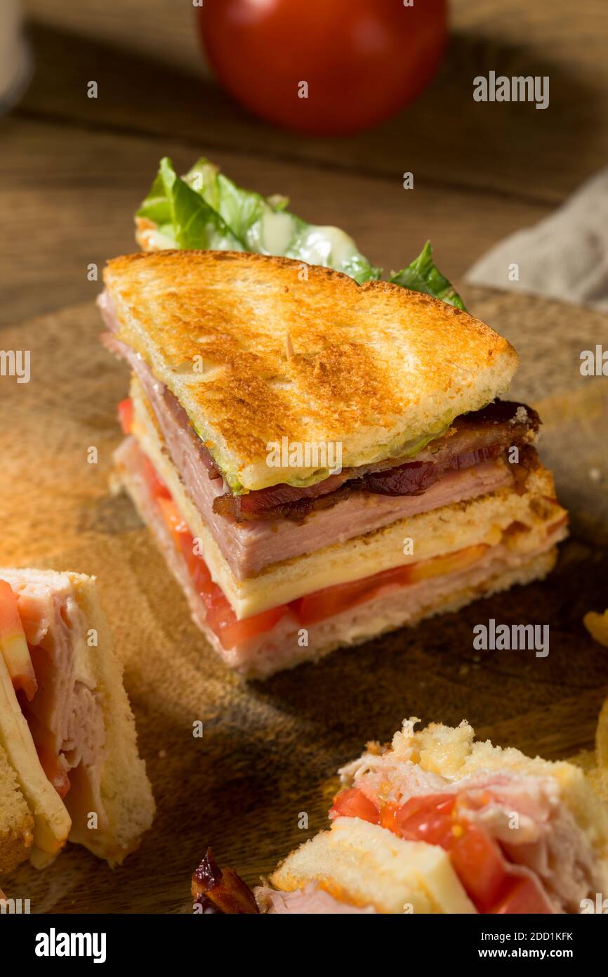 Homemade Turkey Club Sandwich with Bacon Ham and Tomato Stock Photo - Alamy