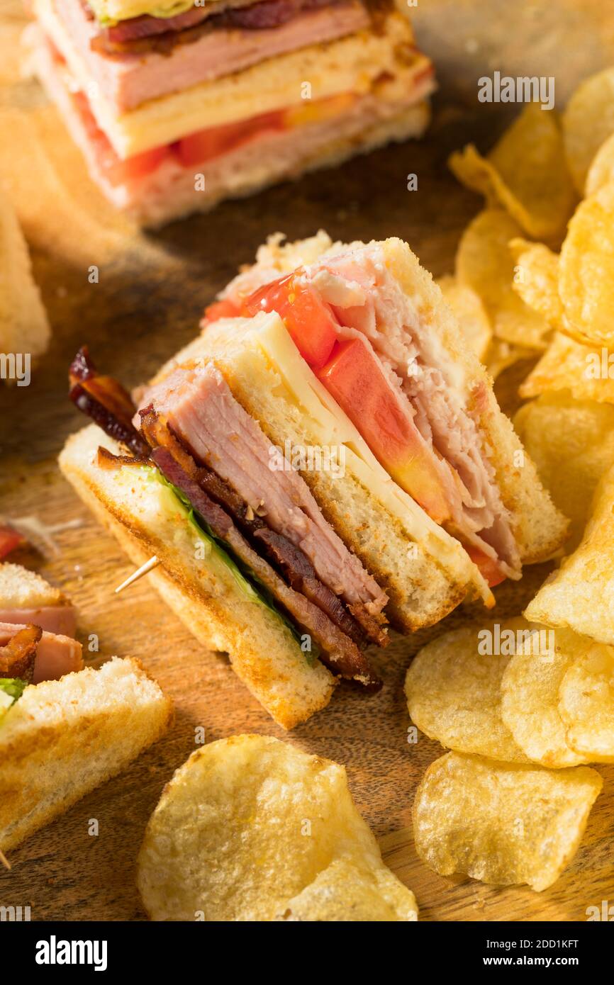 Homemade Turkey Club Sandwich with Bacon Ham and Tomato Stock Photo - Alamy