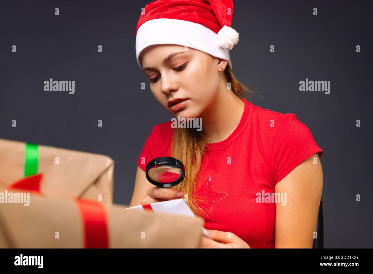 Elf girl portrait with magnifying glass. Concept of letters, gifts and ...