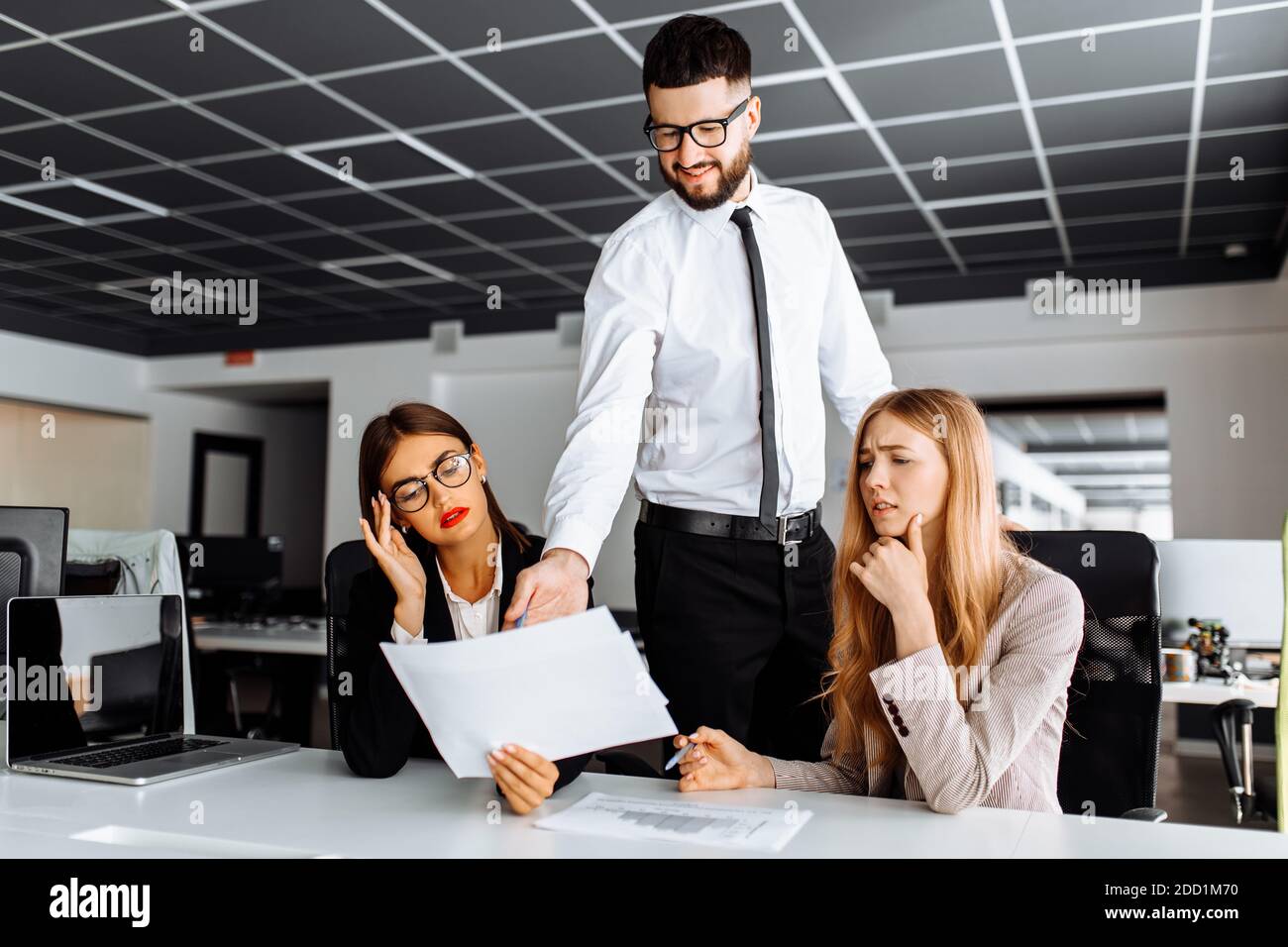 Group of business people together with director working in the office ...