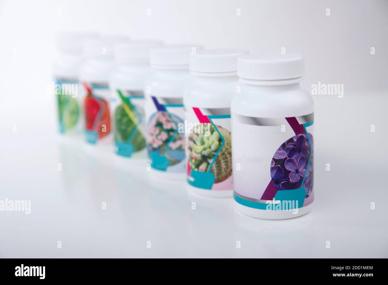 Plant fertilizer bottles isolated on white background Stock Photo - Alamy