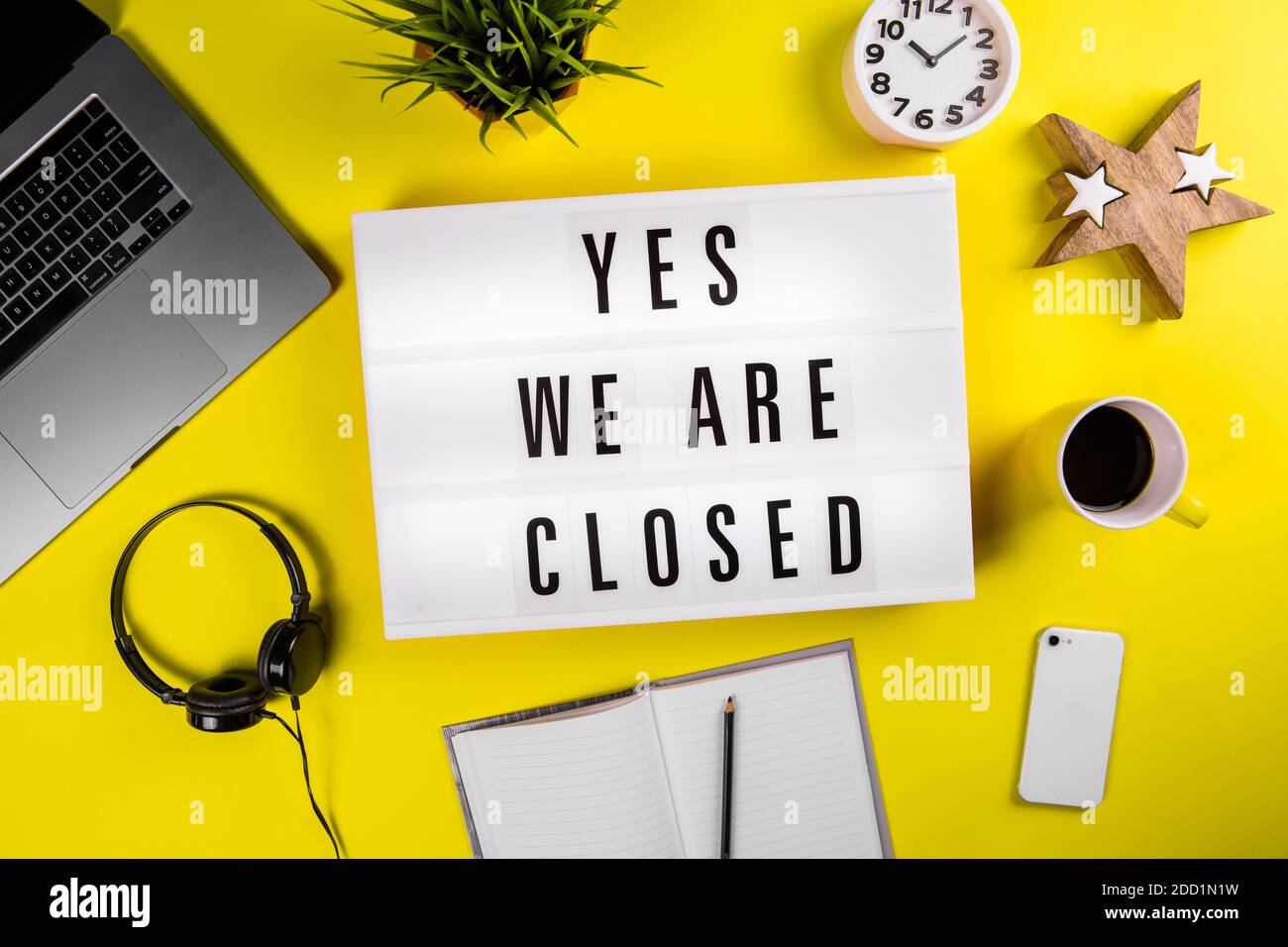 Yes We Are Closed lightbox message on modern yellow office desktop with ...