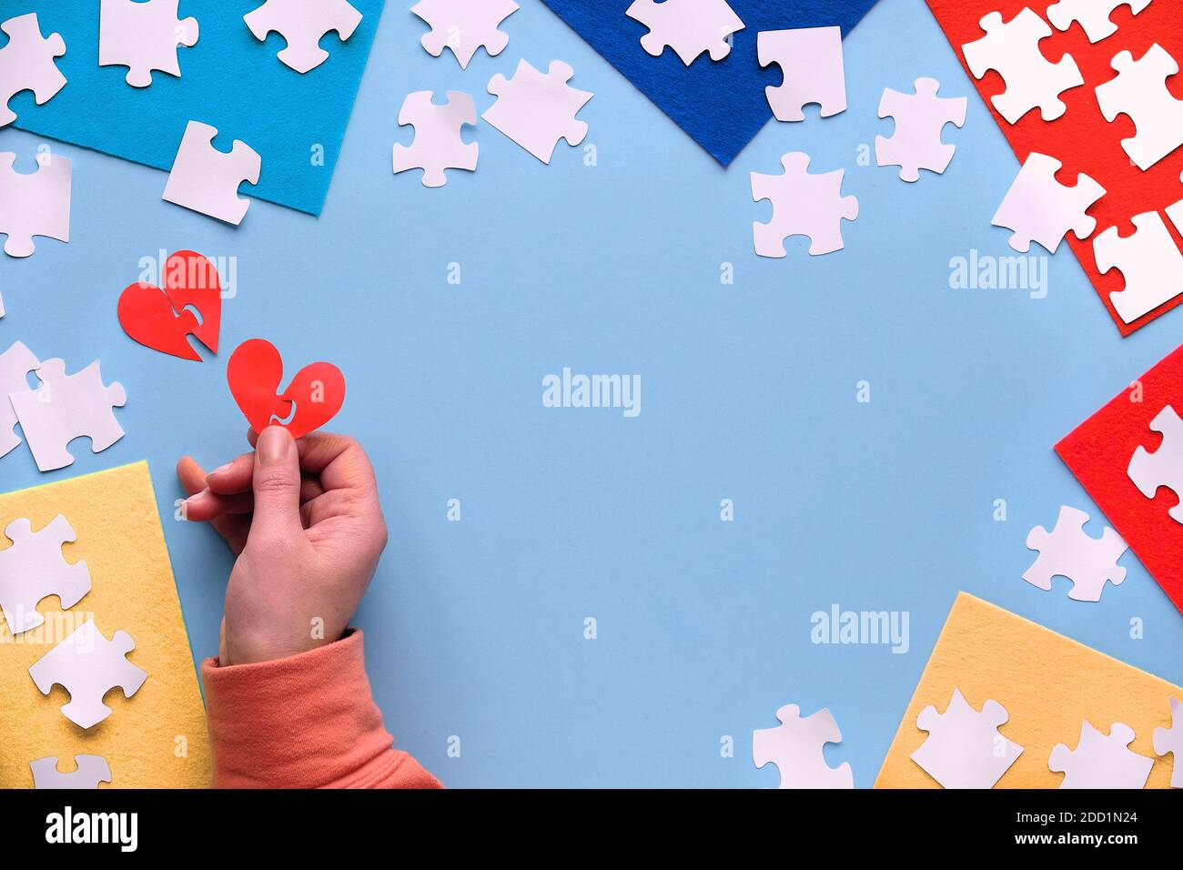 Autism awareness concept. Flat lay, jigsaw puzzle pieces, hand. Text ...
