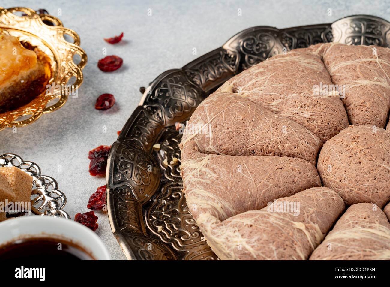 Turkish pastries and scattered dry fruits on table Stock Photo - Alamy