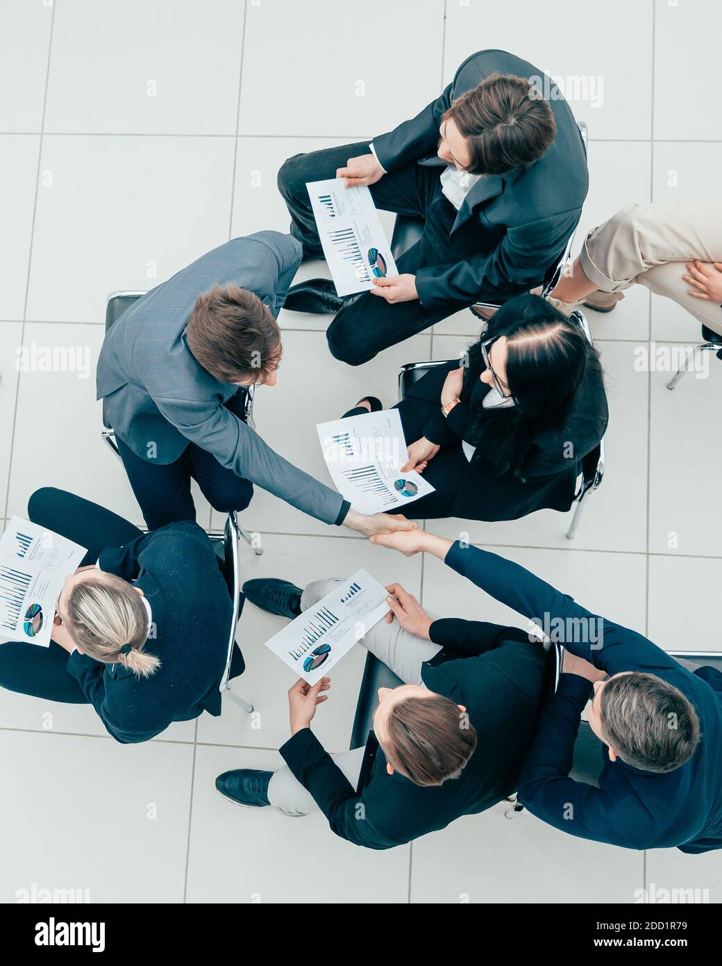 business colleagues supporting each other with a handshake Stock Photo ...