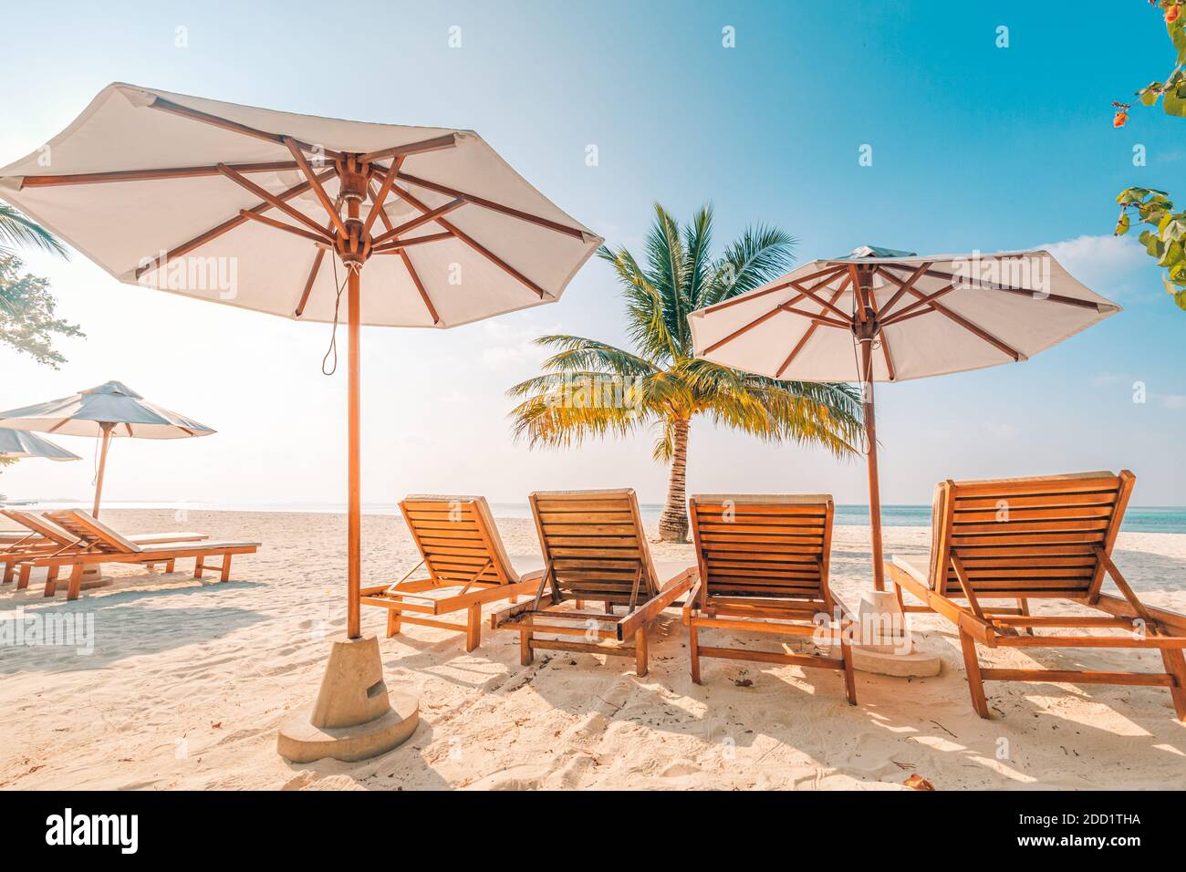 Beautiful sunset relax beach. Chairs on sandy beach near the sea ...