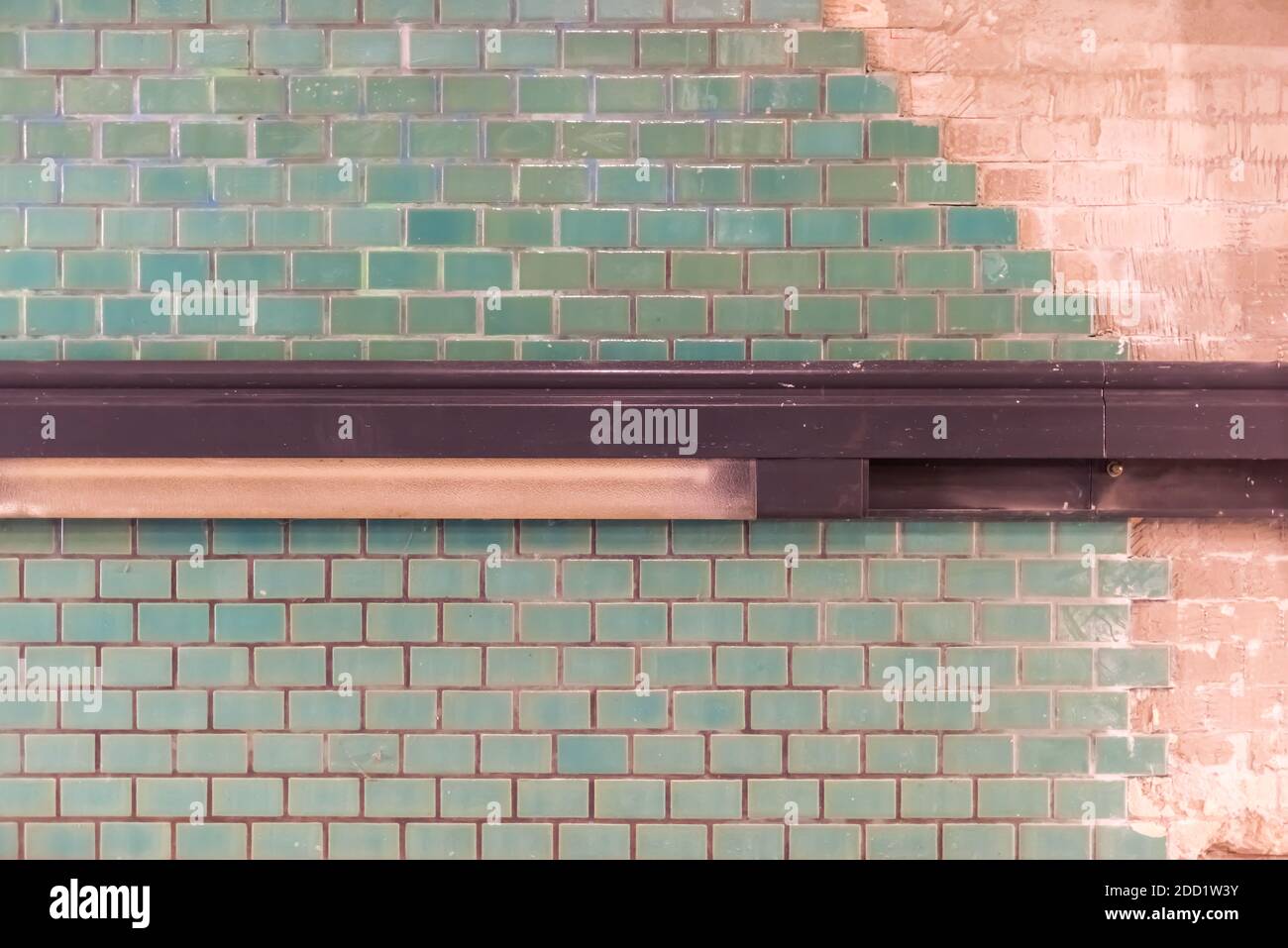 Green tiles on a building site with brown handrail Stock Photo - Alamy
