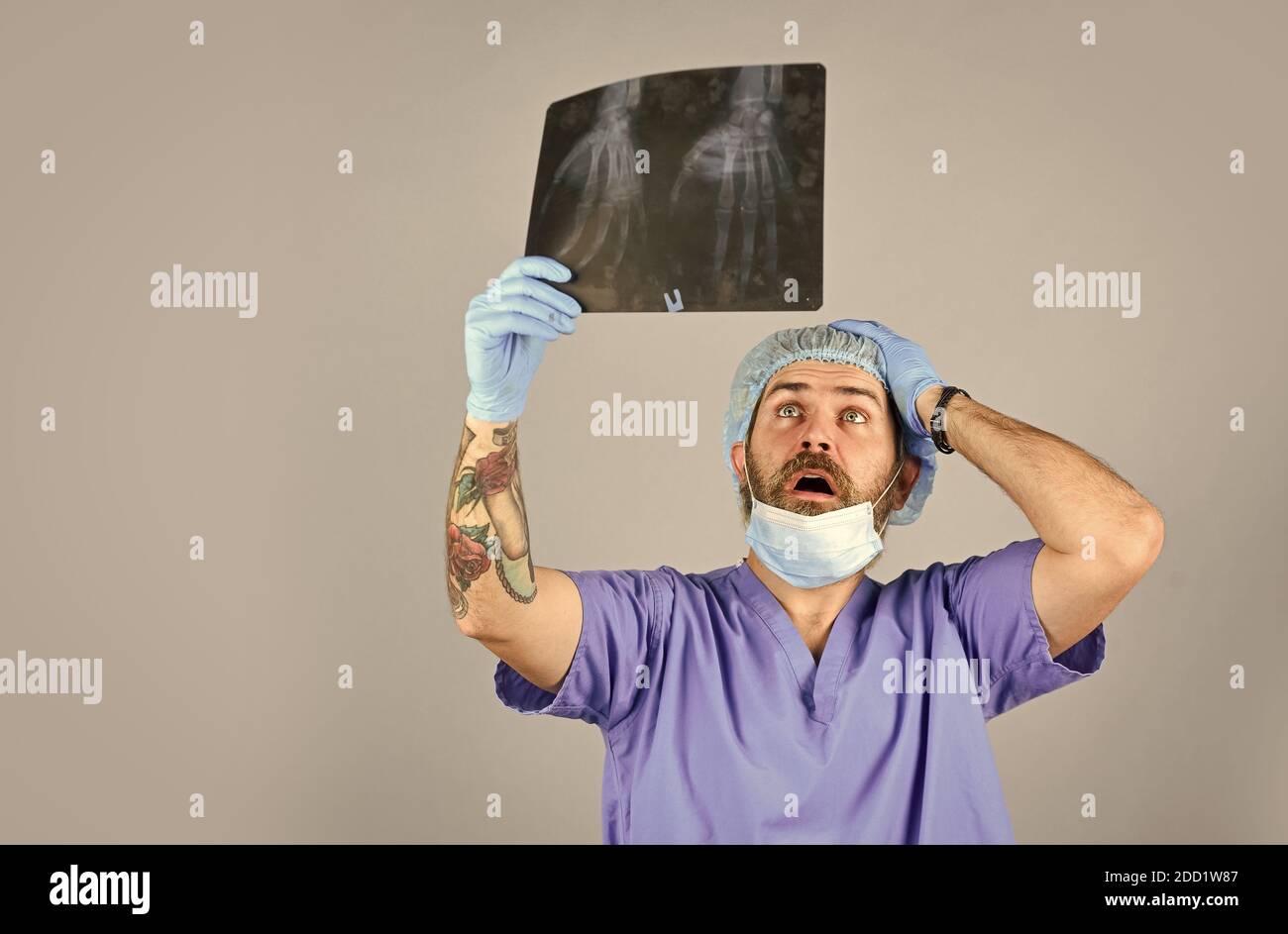 Doctor examines radiographic snapshot of wrist. Surgeon estimate ...