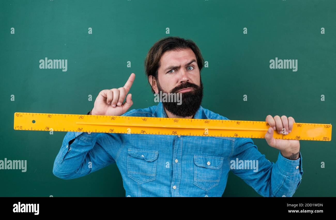 man serious with size measured on ruler math tool, inspired teacher ...