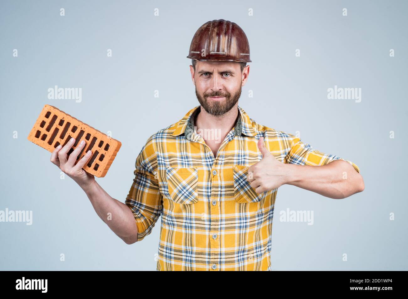 Builder enjoy success. man architect with brick. guy wear worker ...