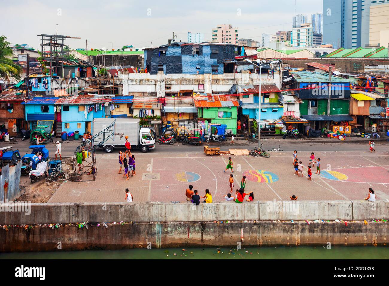MANILA, PHILIPPINES - MARCH 18, 2013: Poor local houses in slum ...