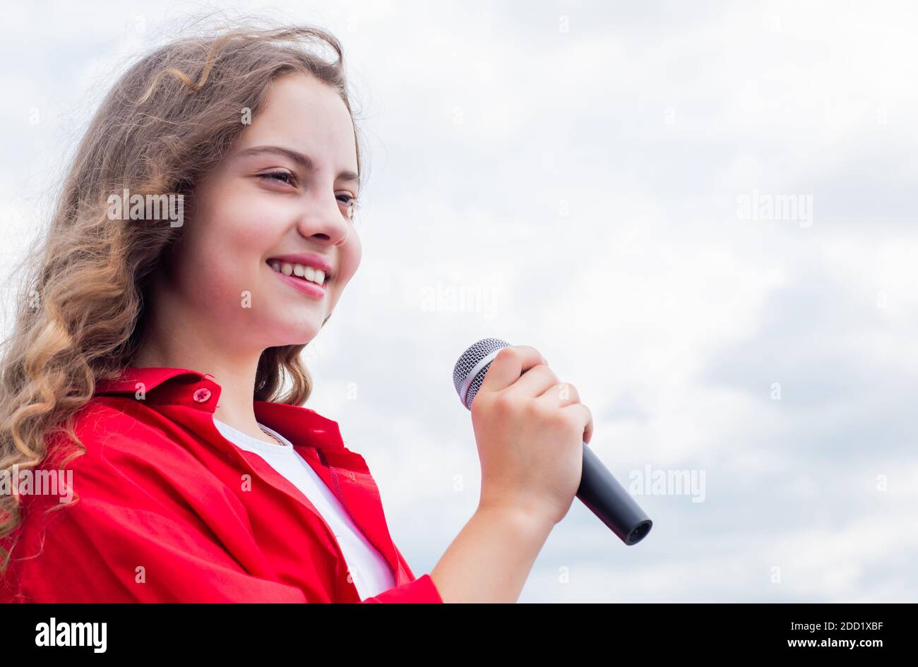 happy kid singer with mic love music, vocal school Stock Photo - Alamy
