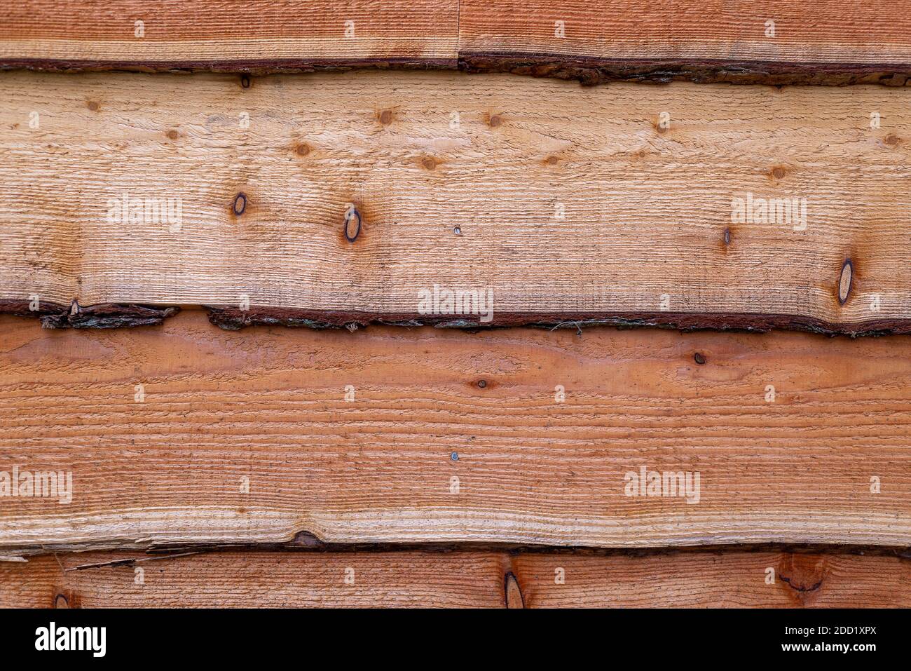 Close up of waney edge wooden cladding boards Stock Photo - Alamy