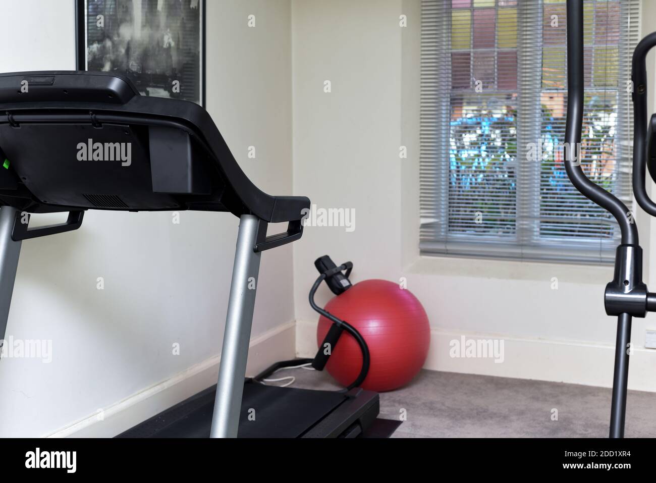 Running machine and gym equipment for keeping fit at home Stock Photo ...