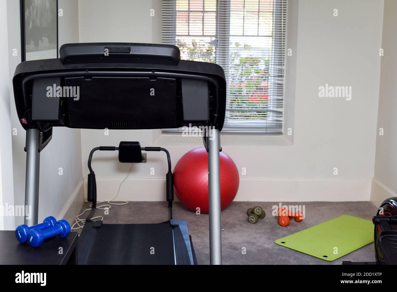 Running machine and gym equipment for keeping fit at home Stock Photo ...