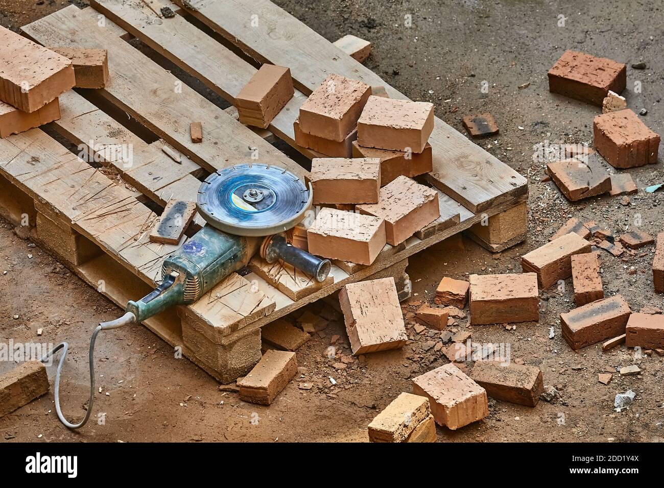 Brick House Construction, Cutting bricks Stock Photo - Alamy