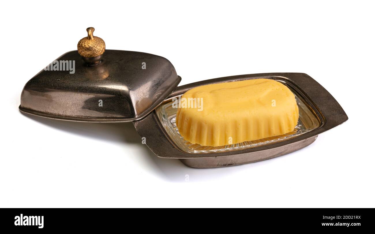 Butter in a retro butter dish on white background Stock Photo - Alamy