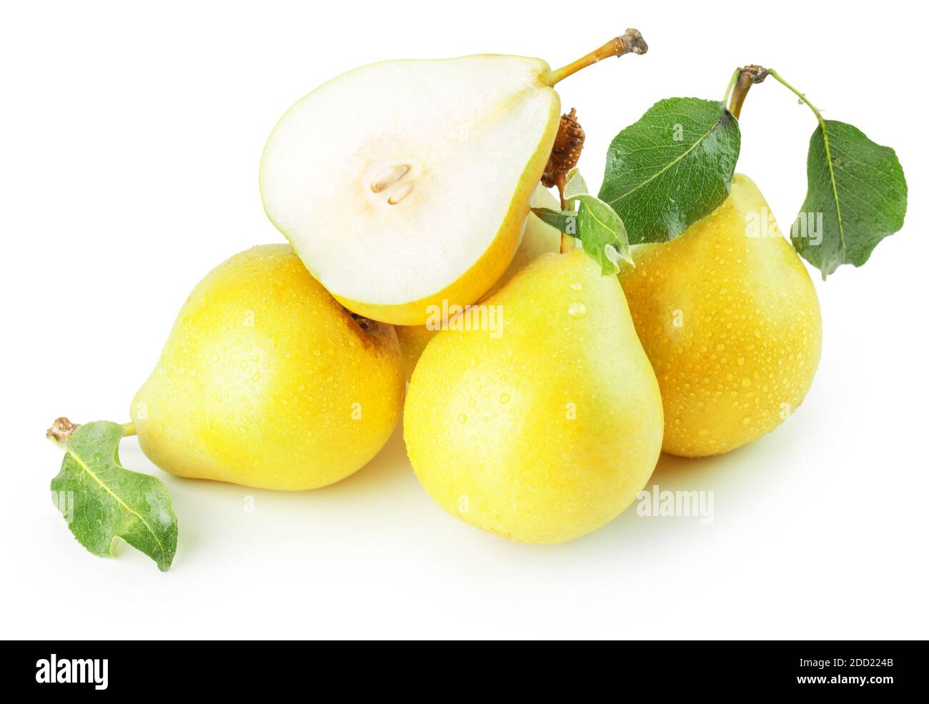 yellow pears with half of pear and green leaves isolated on a white ...