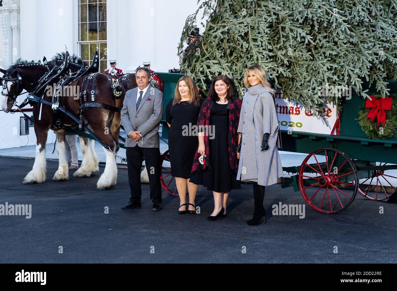 First Lady Melania Trump poses for a photo with the Taylor family next ...