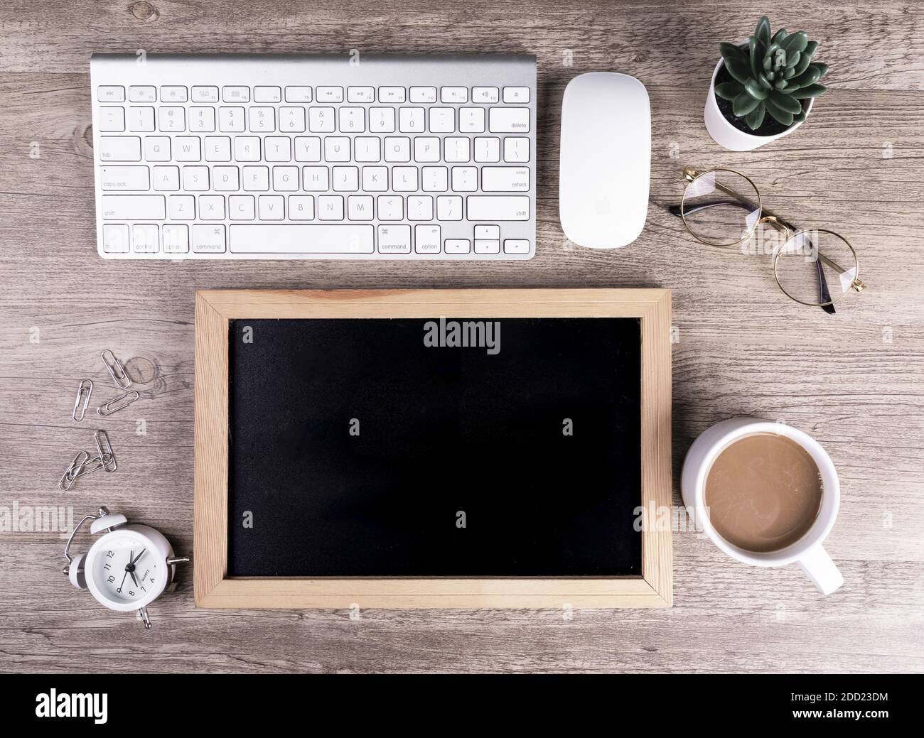 A top view of an office desk with a blank chalkboard Stock Photo - Alamy