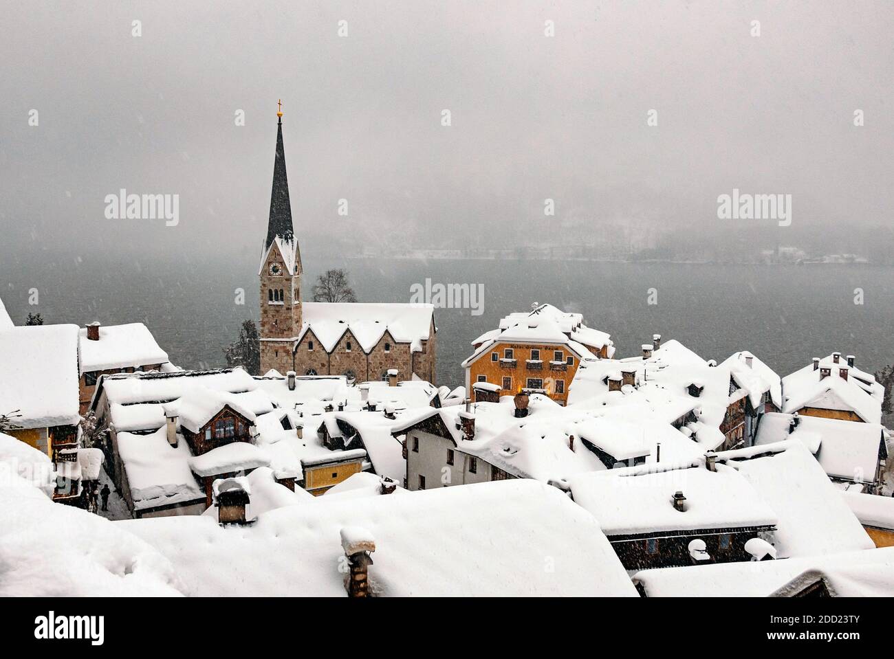 A high angle shot of Hallstatt Austria covered with snow during winter ...