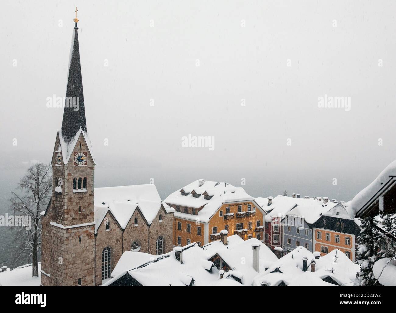 A high angle shot of Hallstatt Austria covered with snow during winter ...