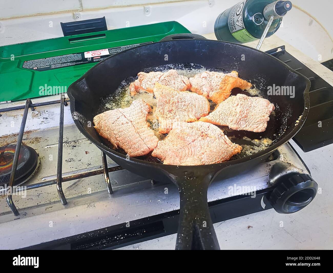 Frying on a gas stove hi-res stock photography and images - Alamy