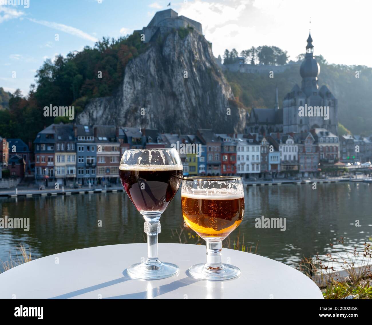 Drinking of dark and strong Belgian abbey beer with cheeses in sunny ...