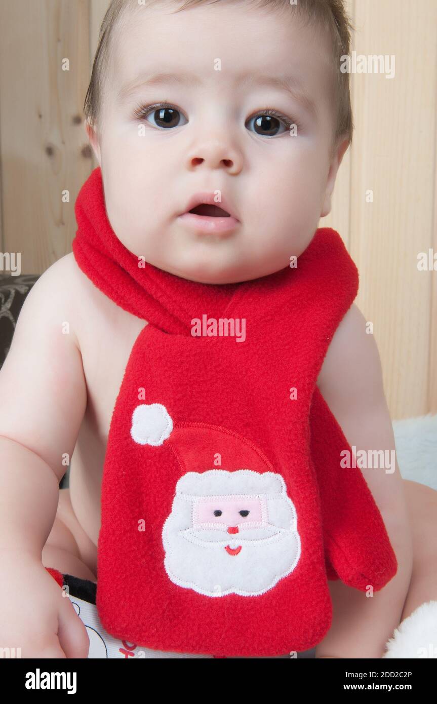 baby dressed like Santa Claus or Noel in Christmas Stock Photo - Alamy